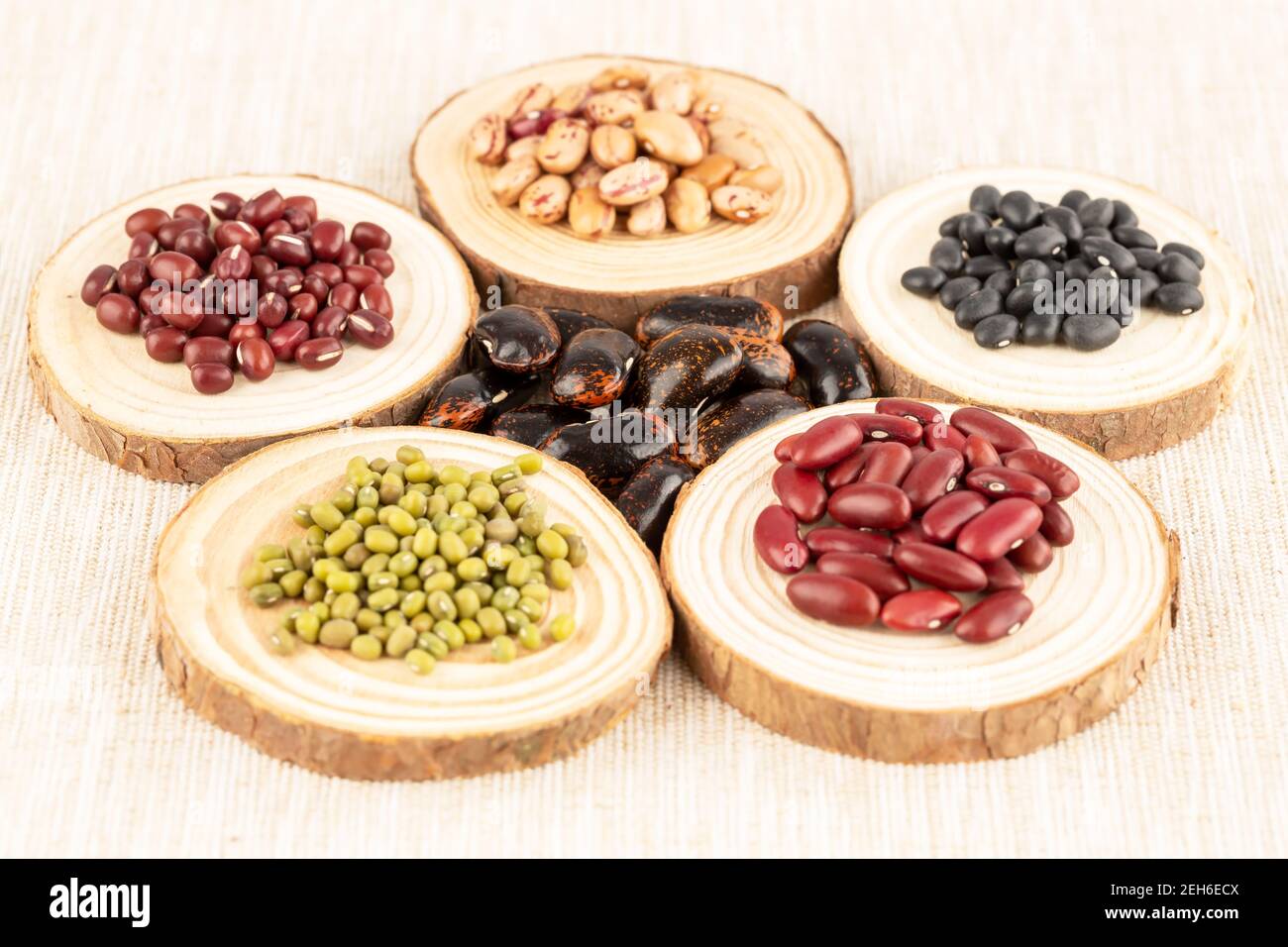 The collection of different beans on the wooden round boards Stock ...