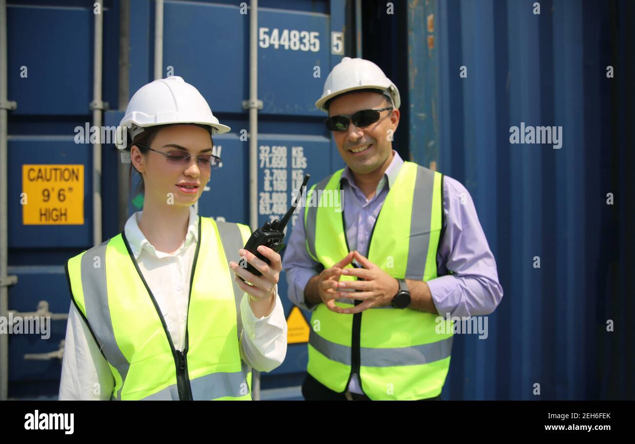 Professional engineer staff team checking and inspect container for international business ...
