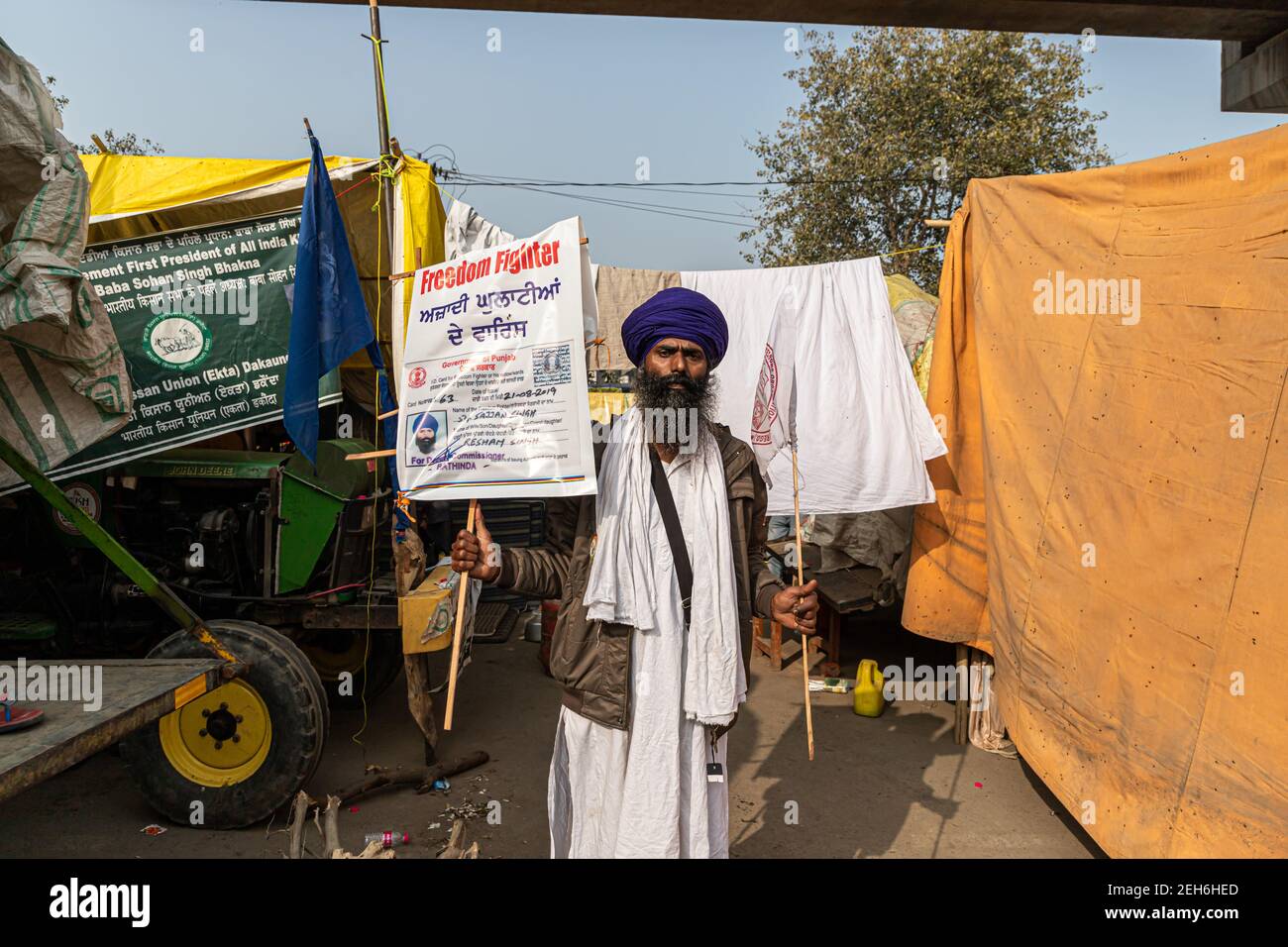 portrait of farmer during the protest at singhu border.they are ...