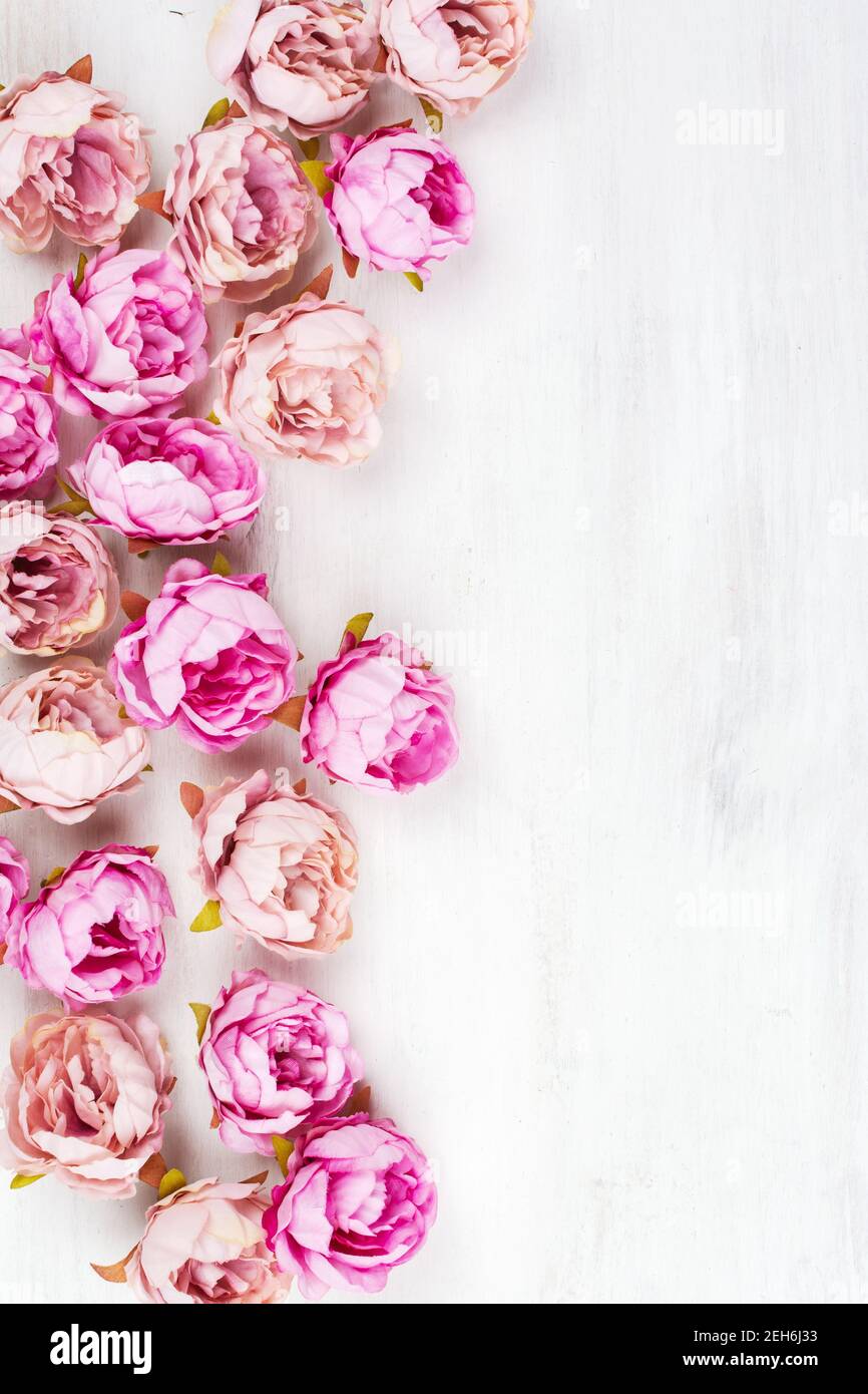 Floral frame on white wood table top view Stock Photo - Alamy