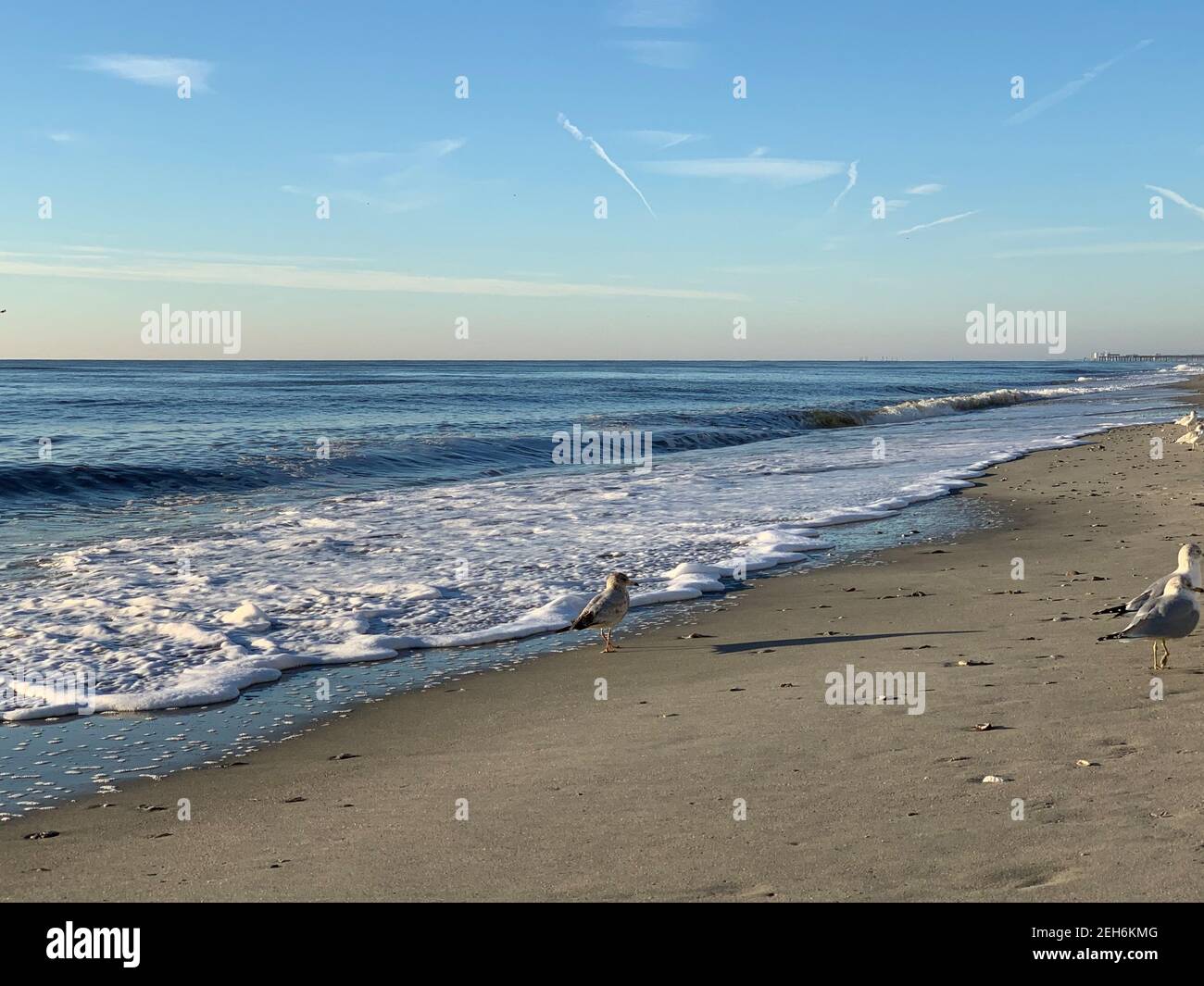 Waves running up the sandy beach in Myrtle Beach, South Carolina on a ...