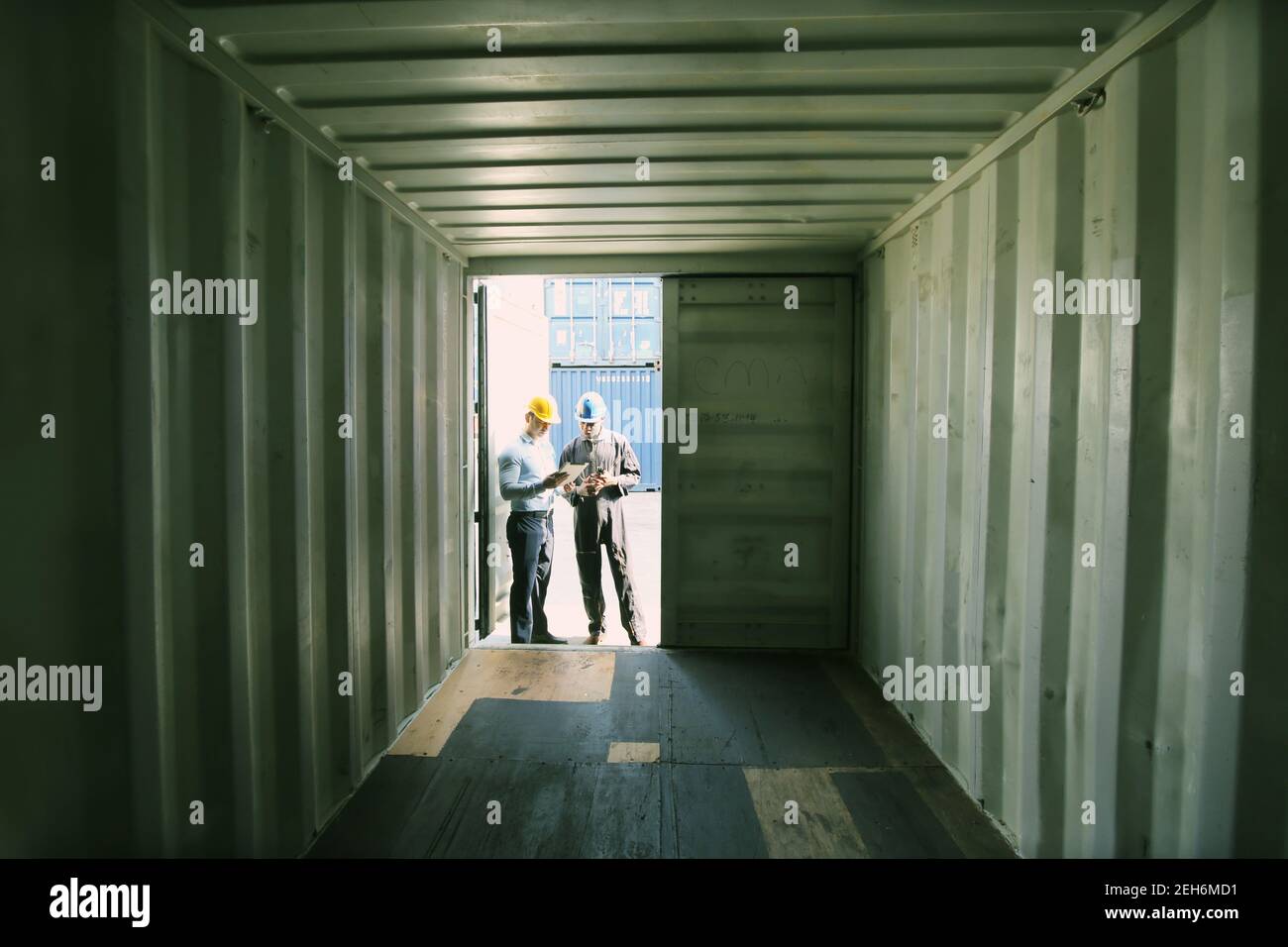 Manager and dock worker under discussion about dock container shipping ...