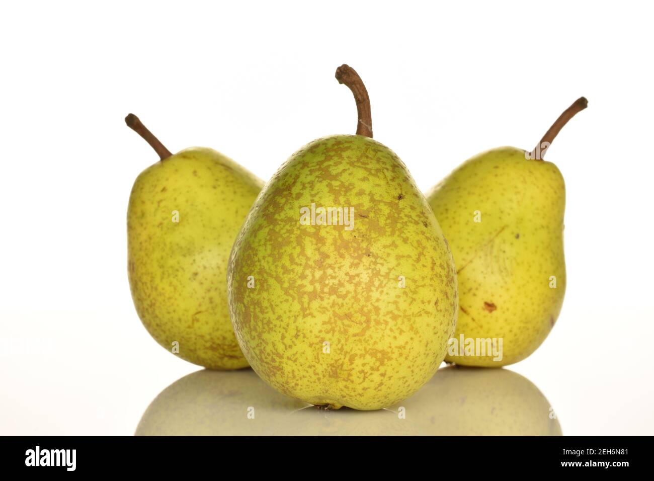A few whole bright green ripe sweet organic Lucas pears on a white ...