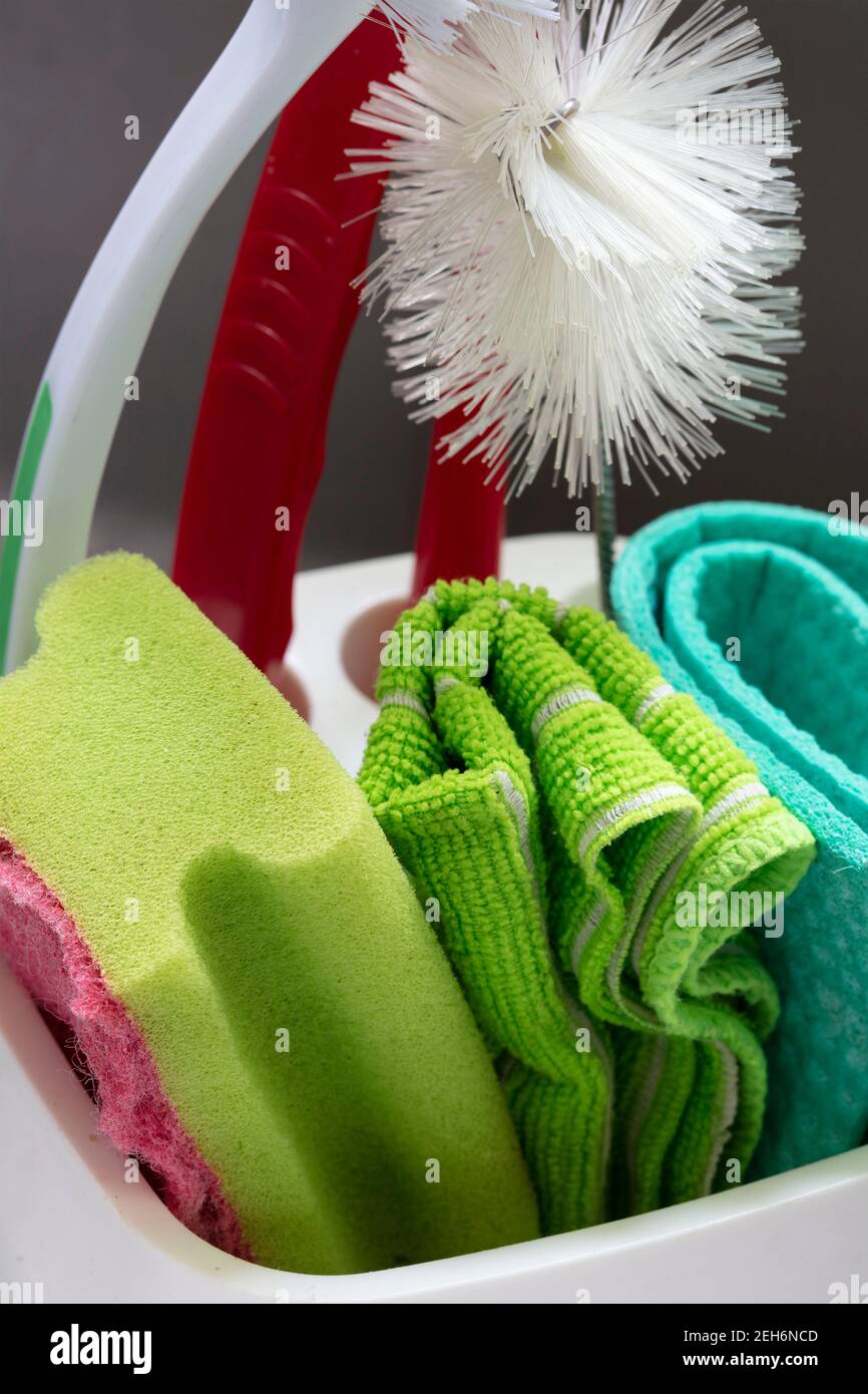 Colourful abstract still-life of kitchen cleaning equipment in close up ...