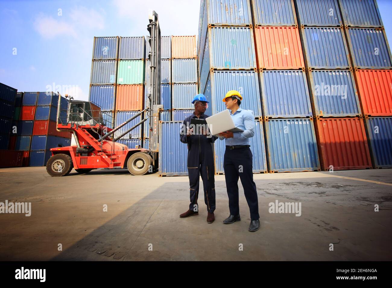 Professional engineer staff team checking and inspect container for international business ...