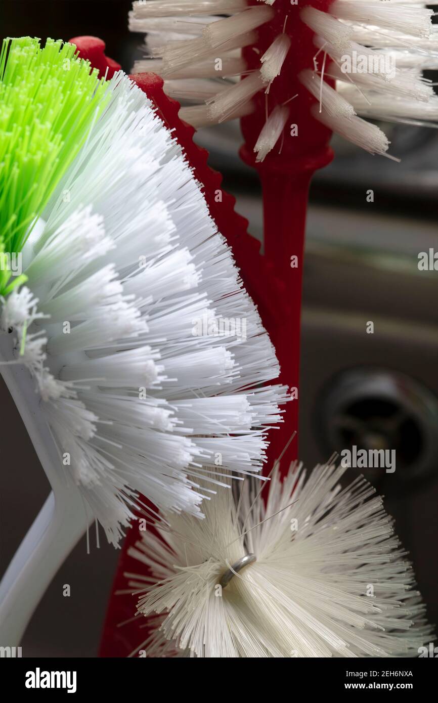 Colourful abstract still-life of kitchen cleaning equipment in close up ...