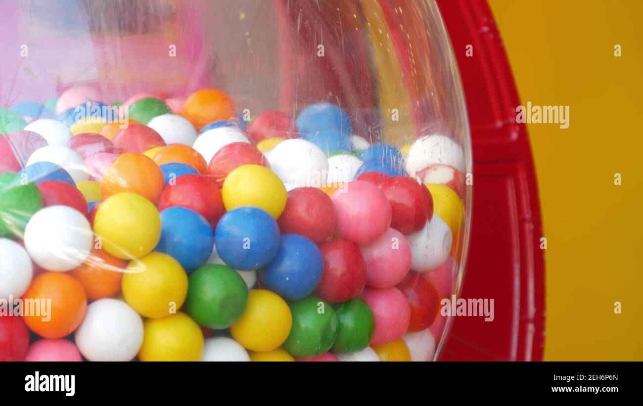 Colorful gumballs in classic vending machine, USA. Multi colored buble ...