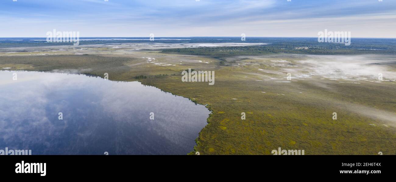 Aerial shot of beautiful Karula National Park full of lakes in Estonia ...