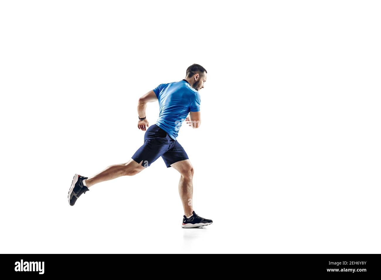 Purpose. Caucasian professional male athlete, runner training isolated ...