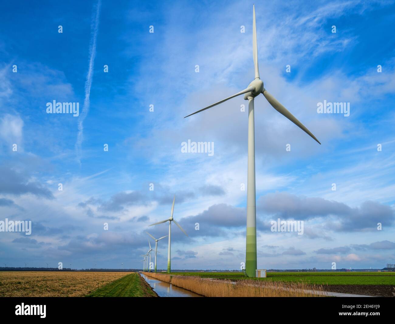 Panoramic landscape with modern windmills Stock Photo - Alamy