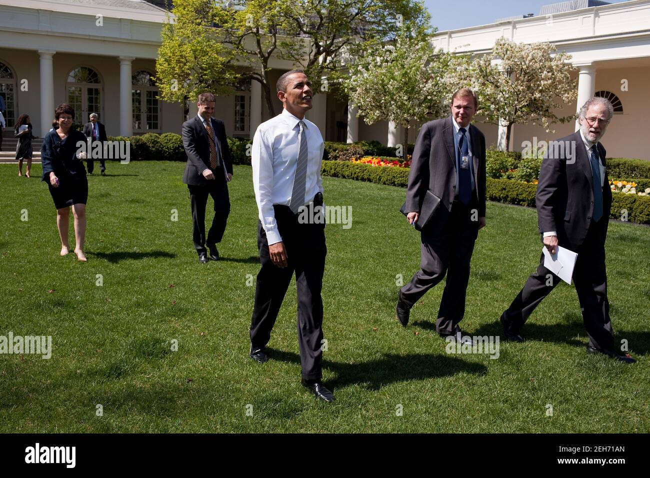 President Barack Obama walks to an outdoor meeting with, from left ...