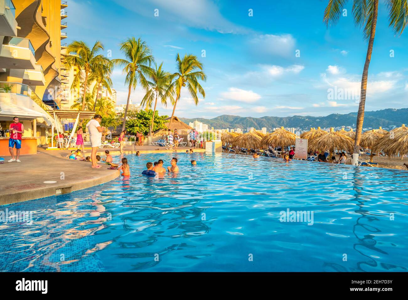 People Enjoy Hotel Swimming Pool In Acapulco Guerrero Mexico Stock