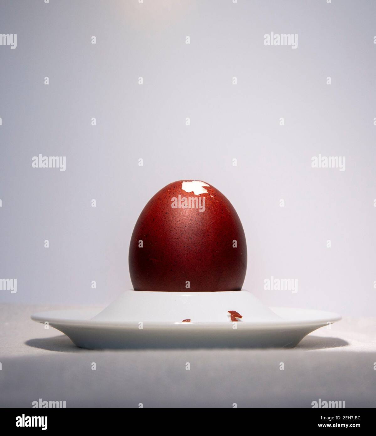 Egg painted for Easter n an egg stand Stock Photo - Alamy