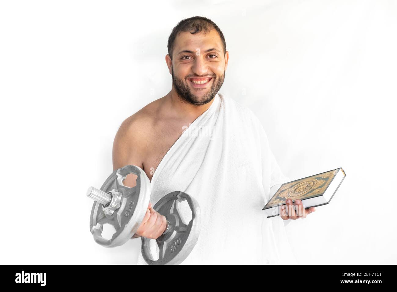 Muslim man showing the strength of the holy Quran Stock Photo - Alamy