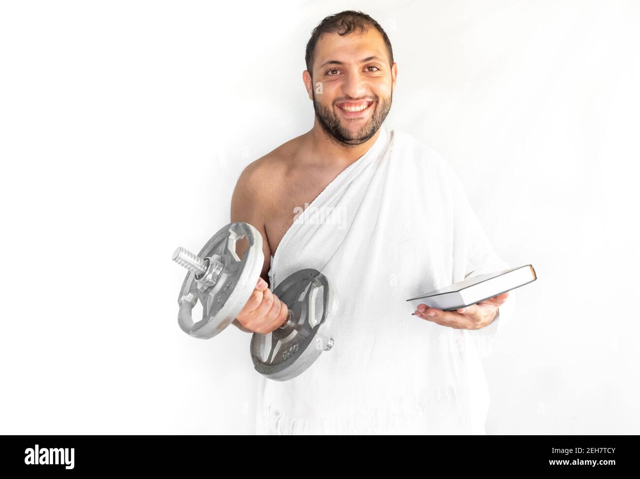 Muslim man showing the strength of the holy Quran Stock Photo - Alamy