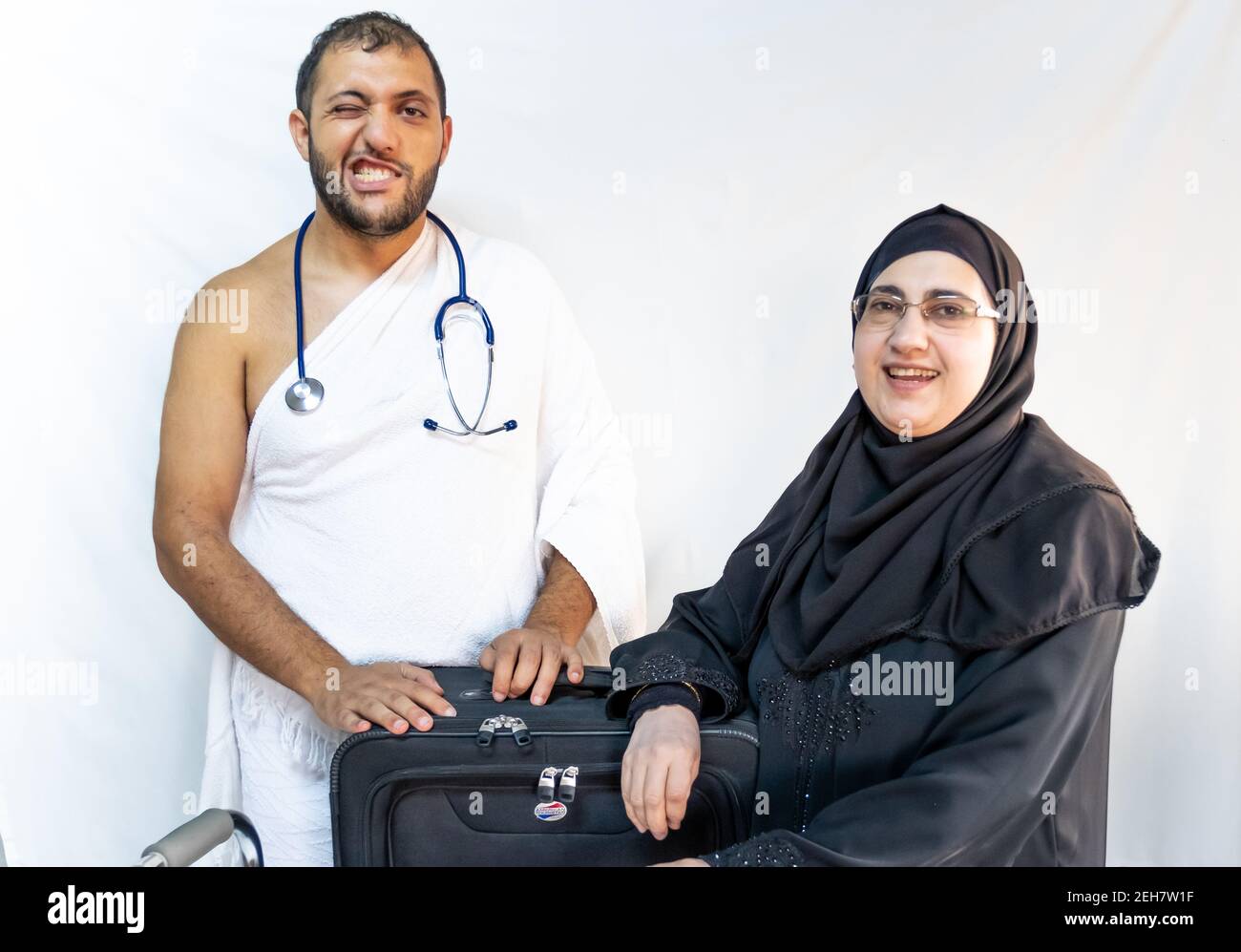 Muslim mother and her son wearing pilgrimage clothes and ready with ...
