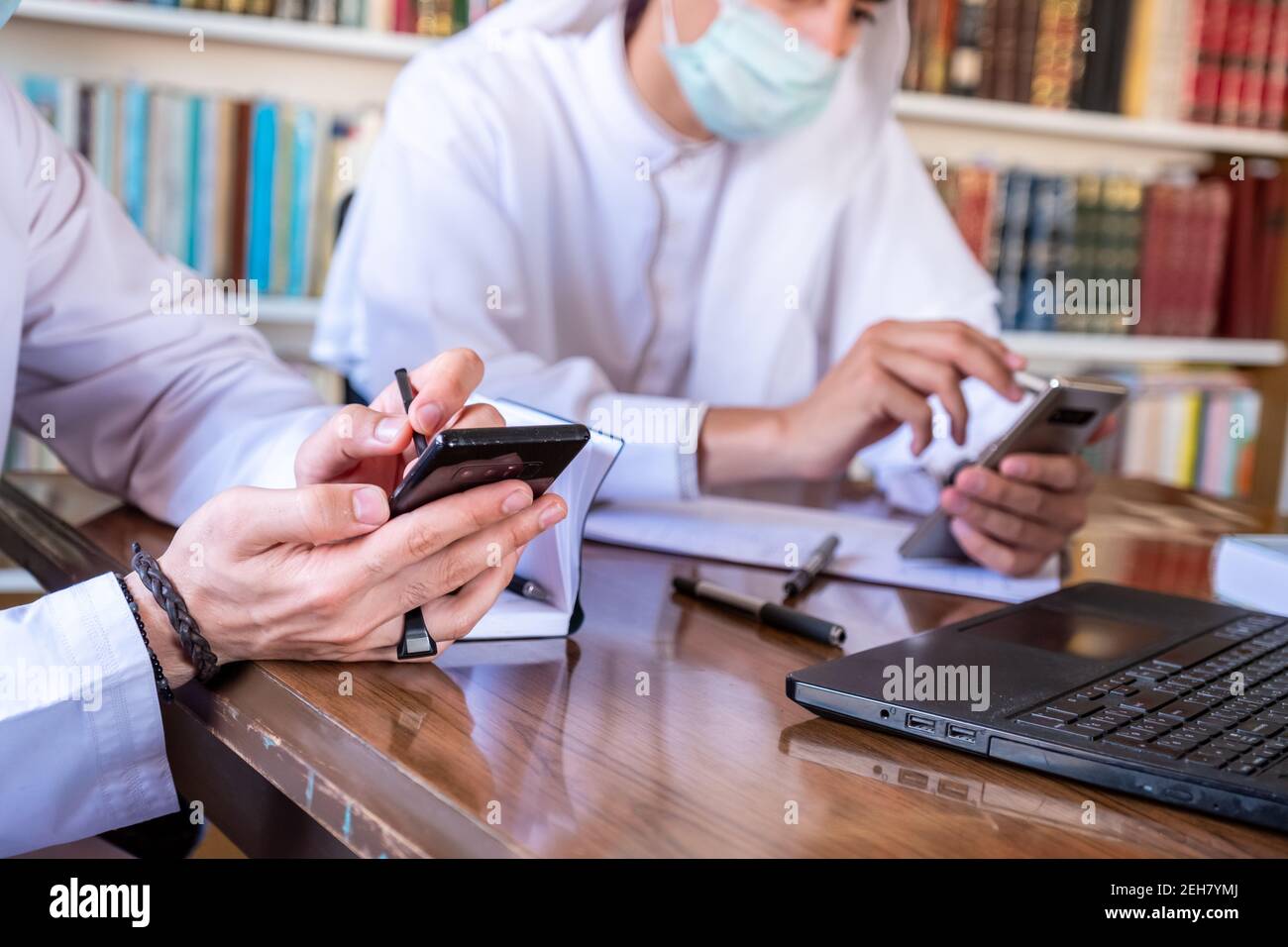 Arabic guys studying for exam together wearing protection masks Stock ...