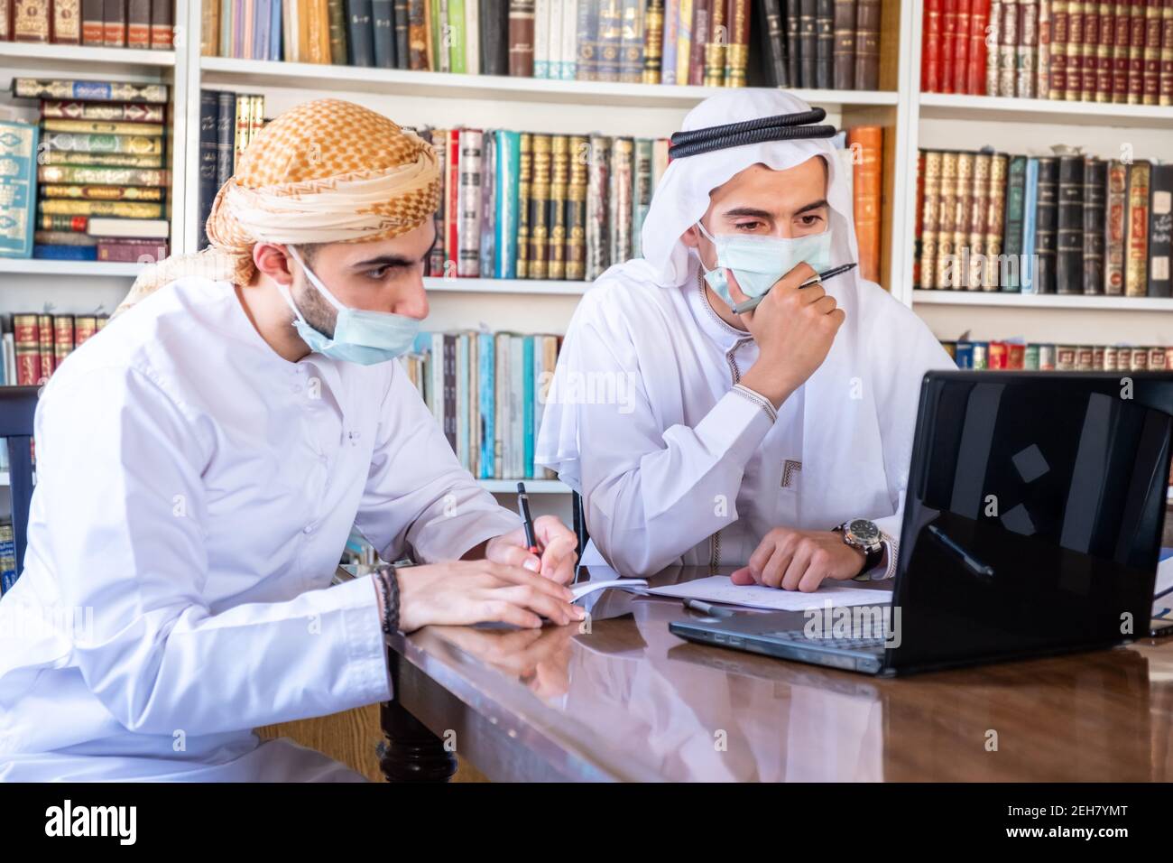 Arabic guys studying for exam together wearing protection masks Stock ...
