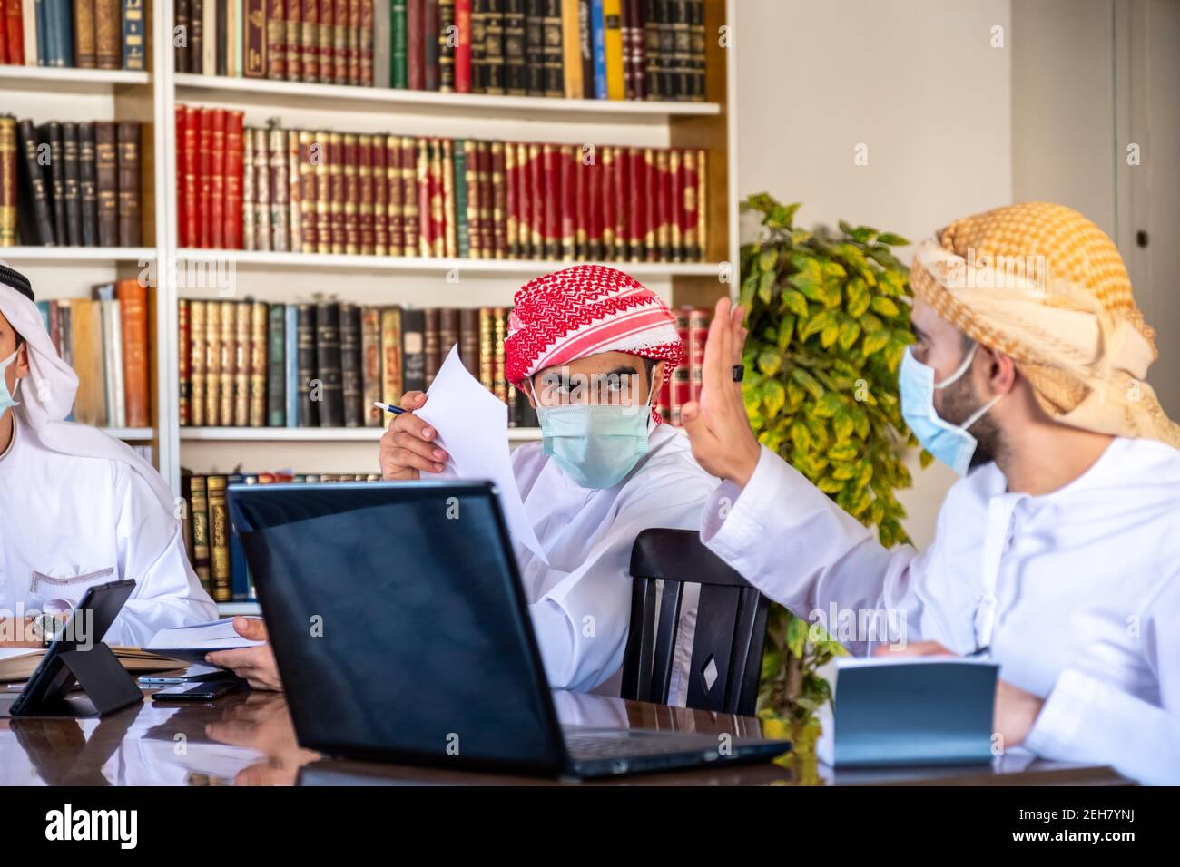 Arabic guys studying for exam together wearing protection masks Stock ...