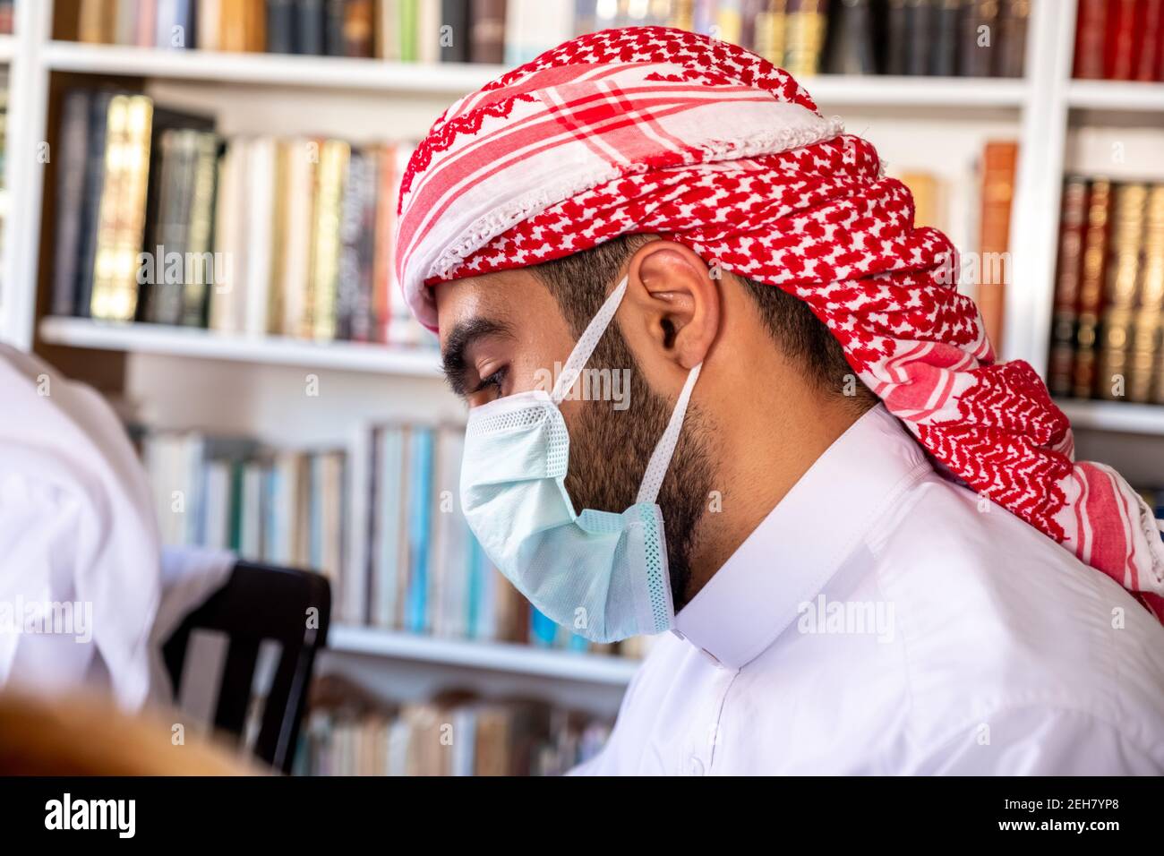 Arabic guys studying for exam together wearing protection masks Stock ...