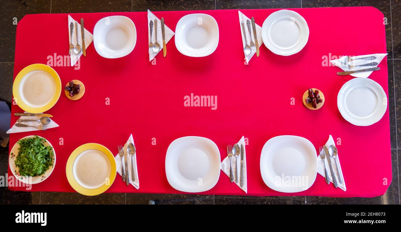 Table with empty plates being prepared for ramadan iftar Stock Photo ...