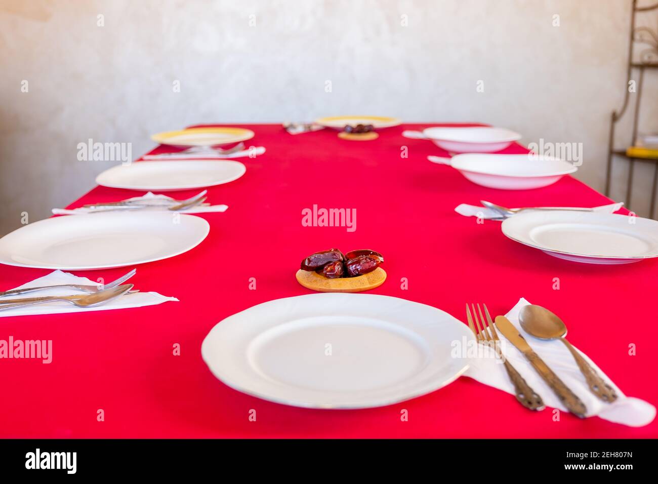Table with empty plates being prepared for ramadan iftar Stock Photo ...
