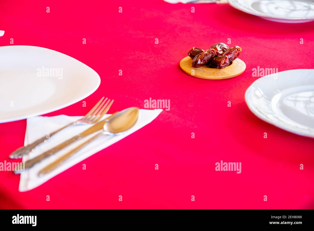 Table with empty plates being prepared for ramadan iftar Stock Photo ...