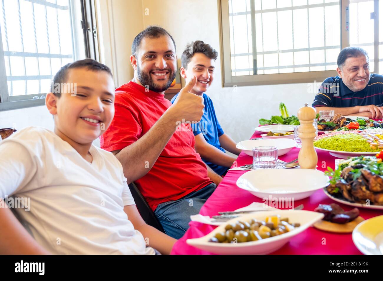 Arabic muslim family eating together in a meeting for iftar in ramdan ...