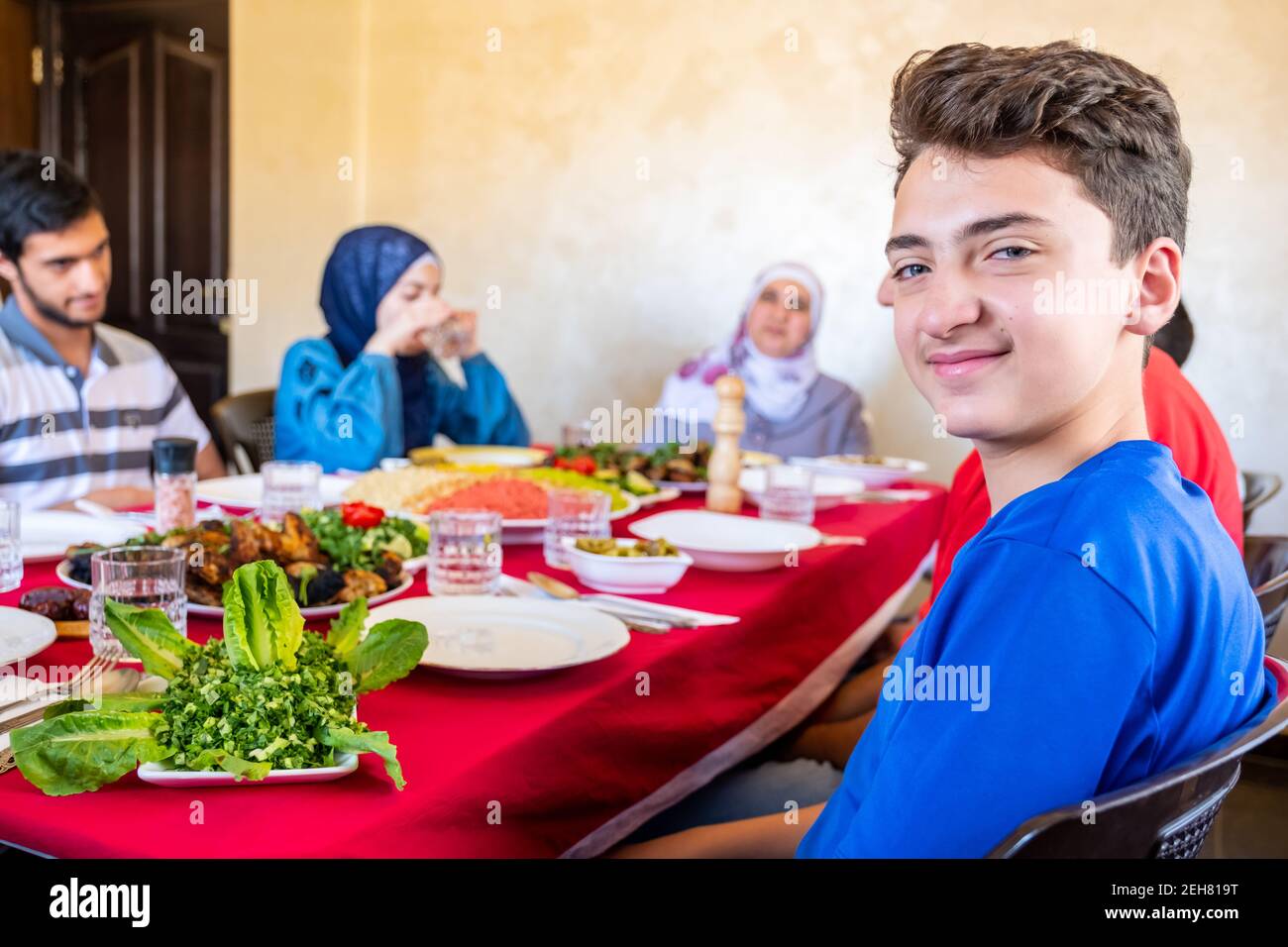 Child parents kitchen eating laughter hi-res stock photography and ...