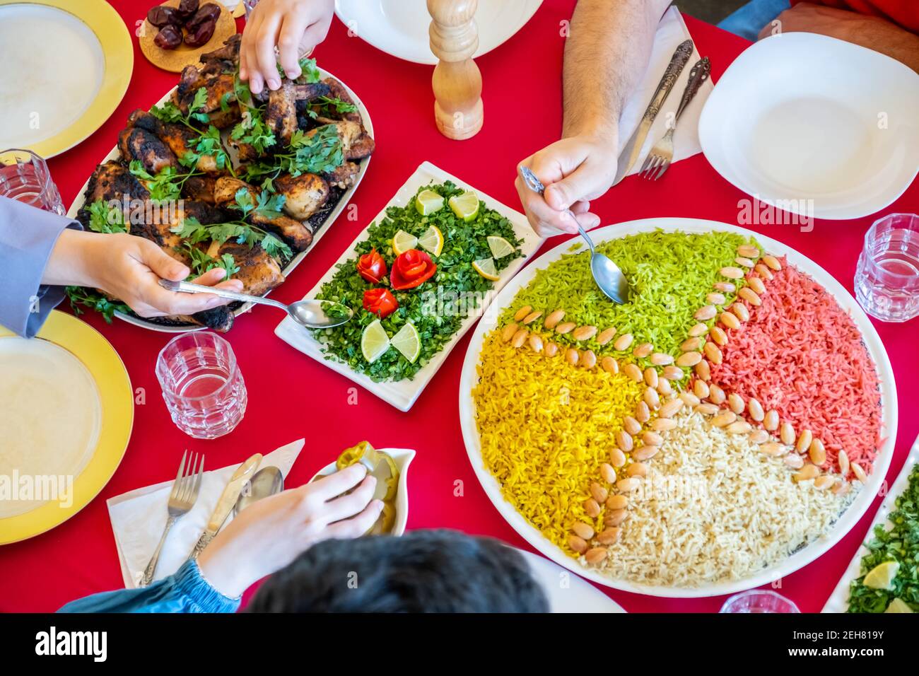 Arabic muslim family eating together Stock Photo - Alamy