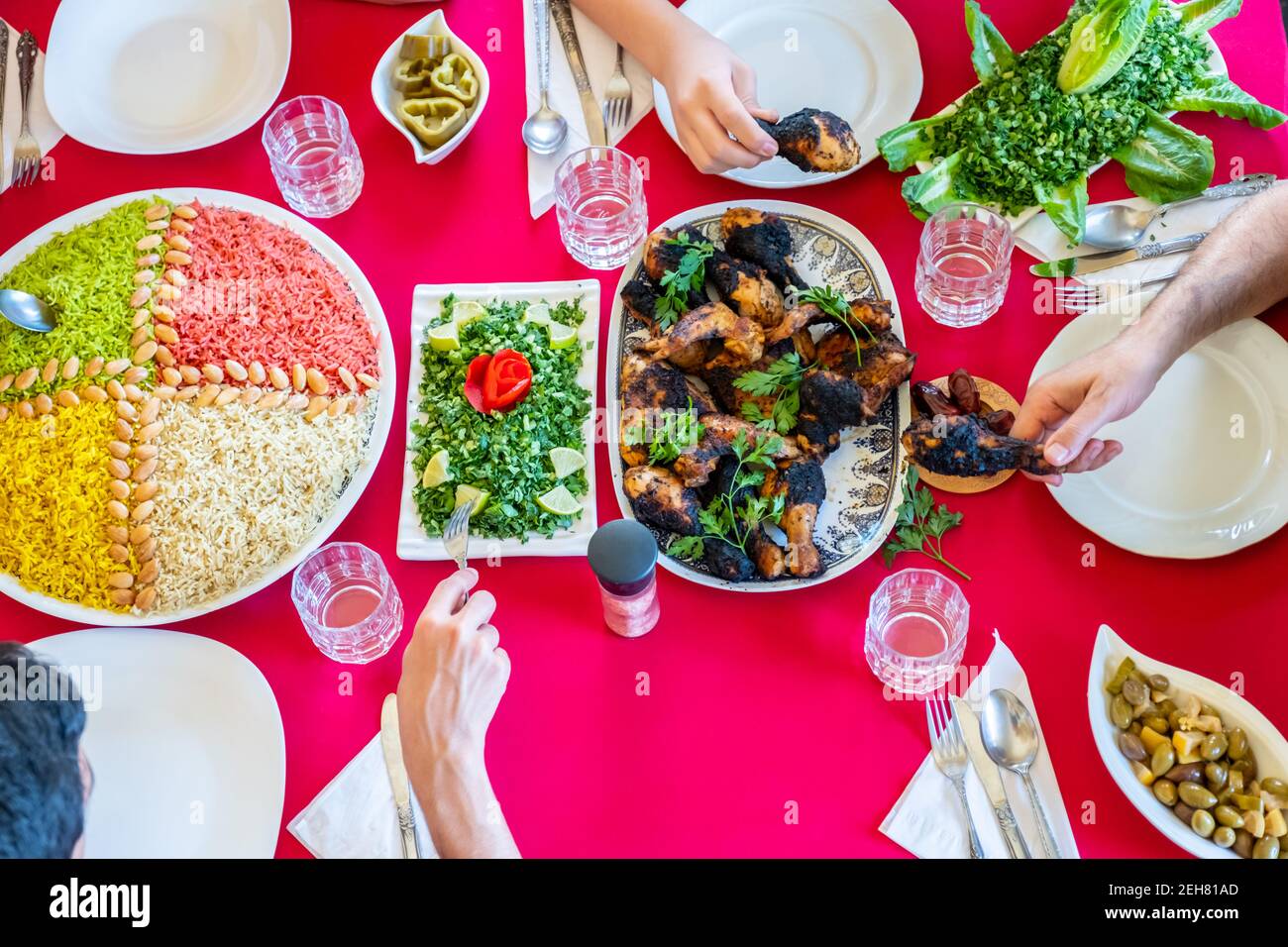 Arabic family eating with hands hi-res stock photography and images - Alamy