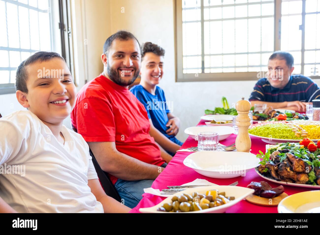 Arabic muslim family eating together in a meeting for iftar in ramdan ...