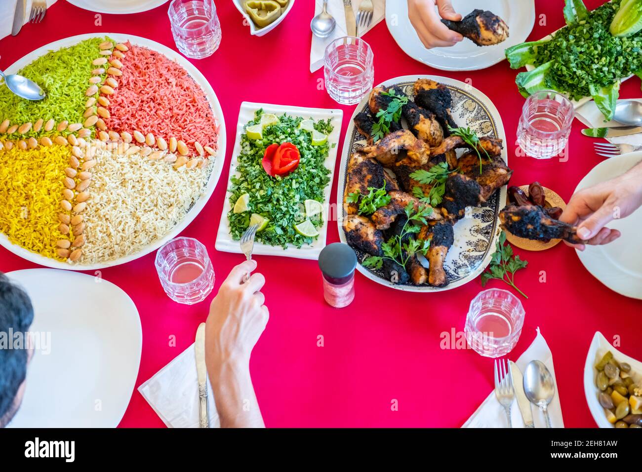 Arabic family eating with hands hi-res stock photography and images - Alamy