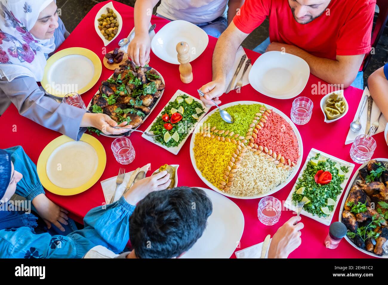 Arabic muslim family eating together Stock Photo - Alamy