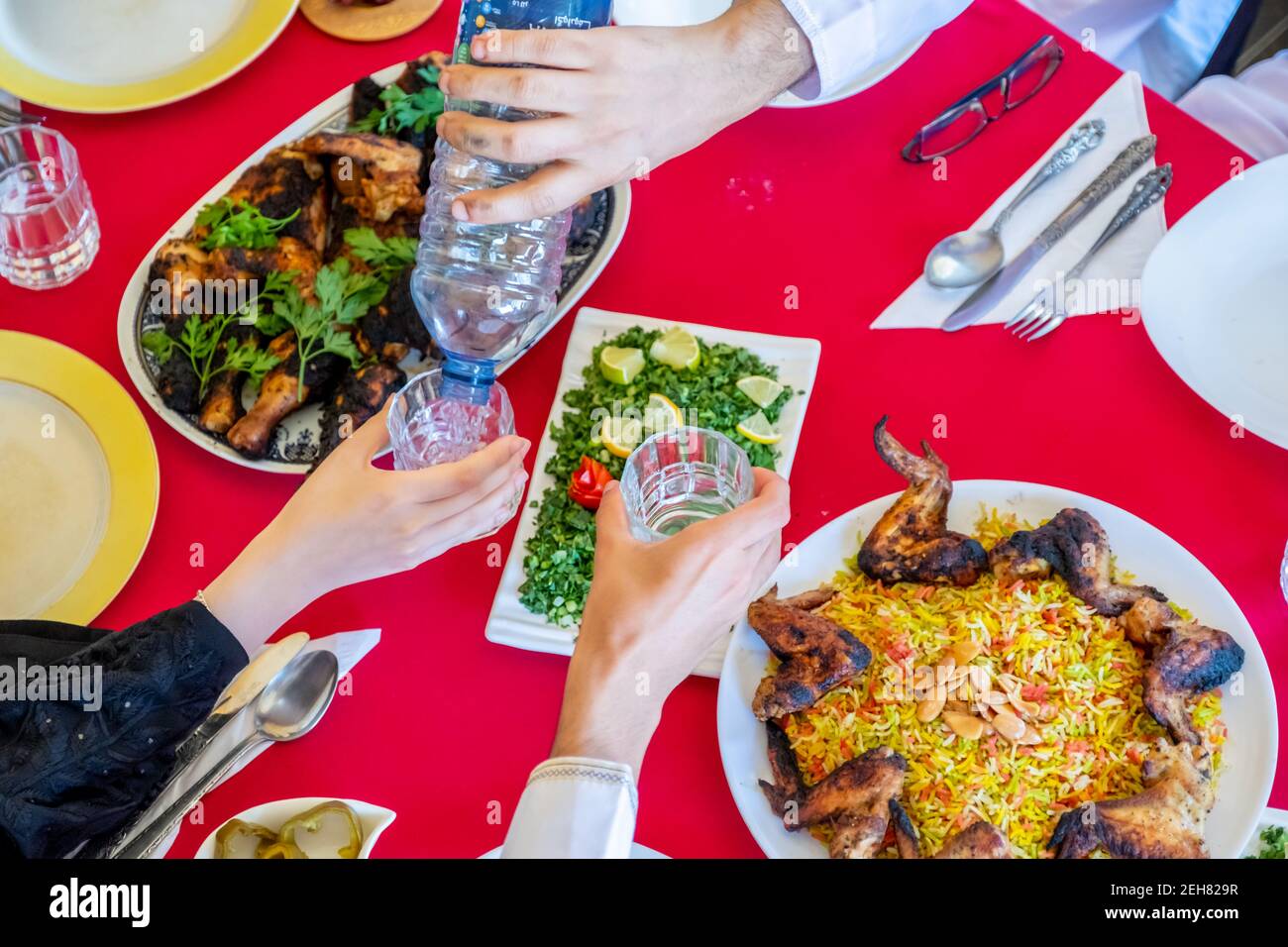 Arabic muslim family eating together Stock Photo - Alamy