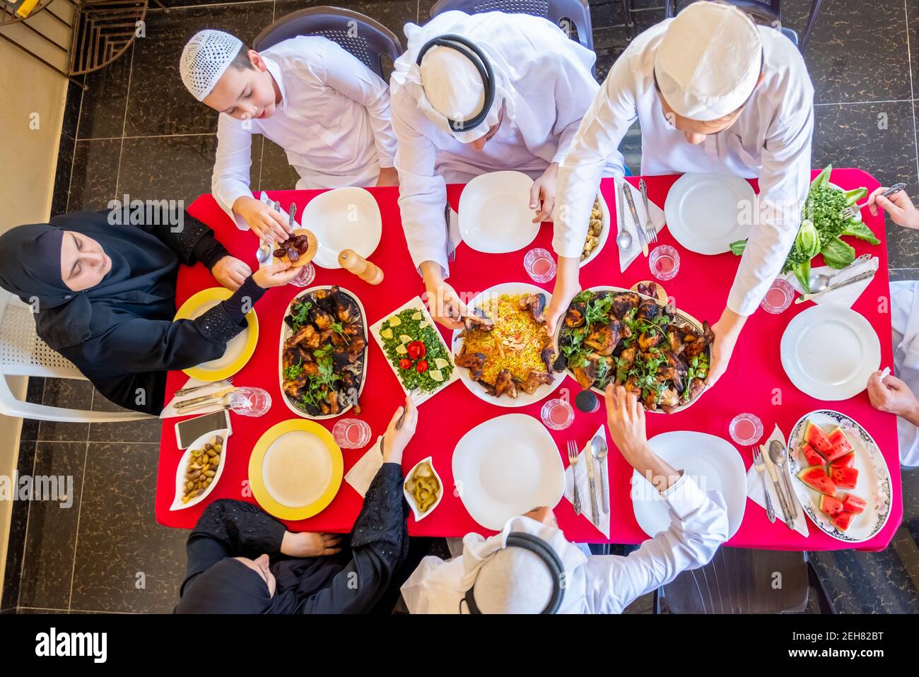 Arabic muslim family eating together Stock Photo - Alamy