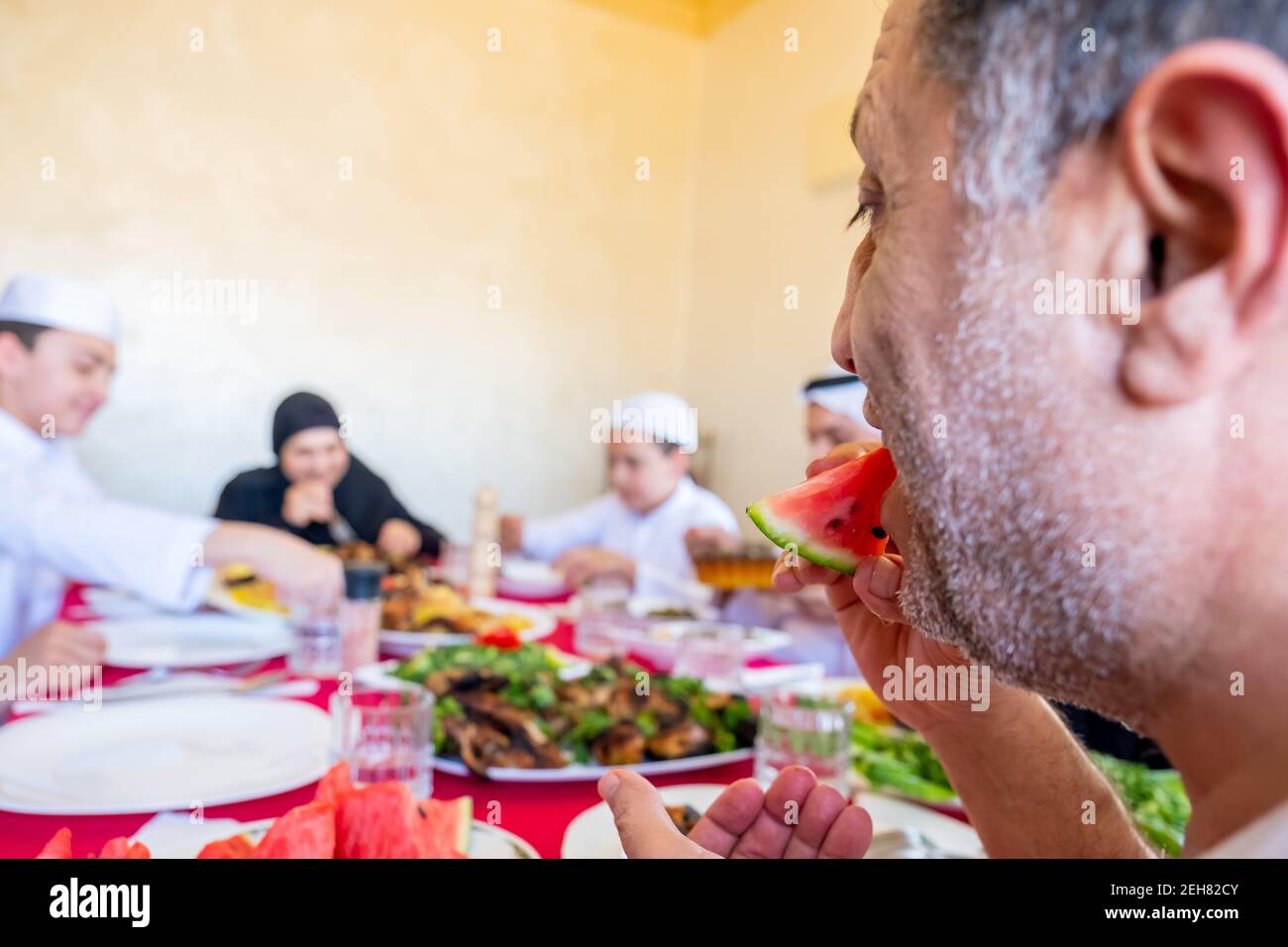 Child parents kitchen eating laughter hi-res stock photography and ...