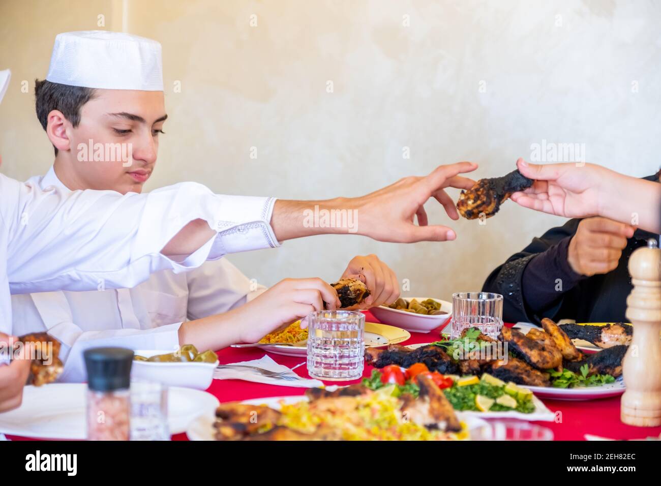 Arabic muslim family eating together in a meeting for iftar in ramdan ...