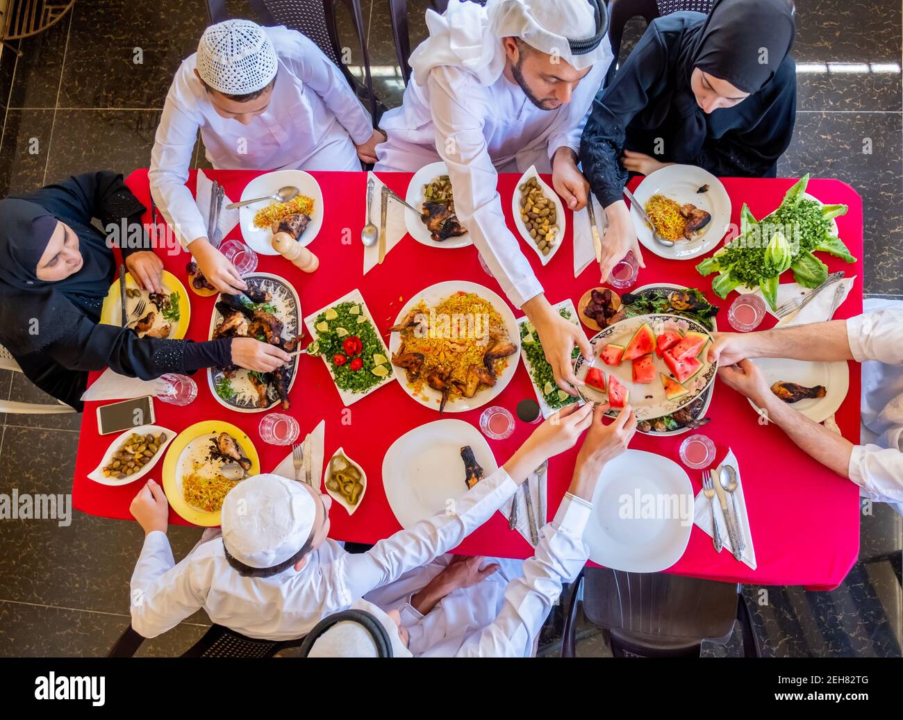 Arabic muslim family eating together Stock Photo - Alamy