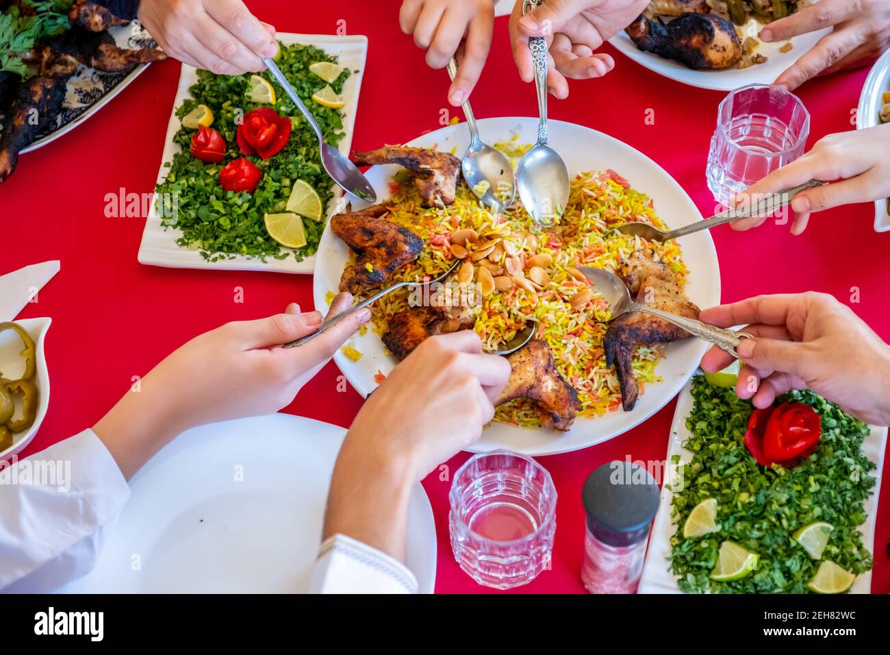 Arabic muslim family eating together Stock Photo - Alamy
