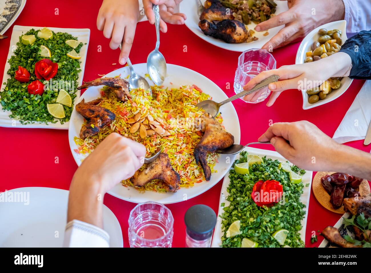 Arabic muslim family eating together Stock Photo - Alamy