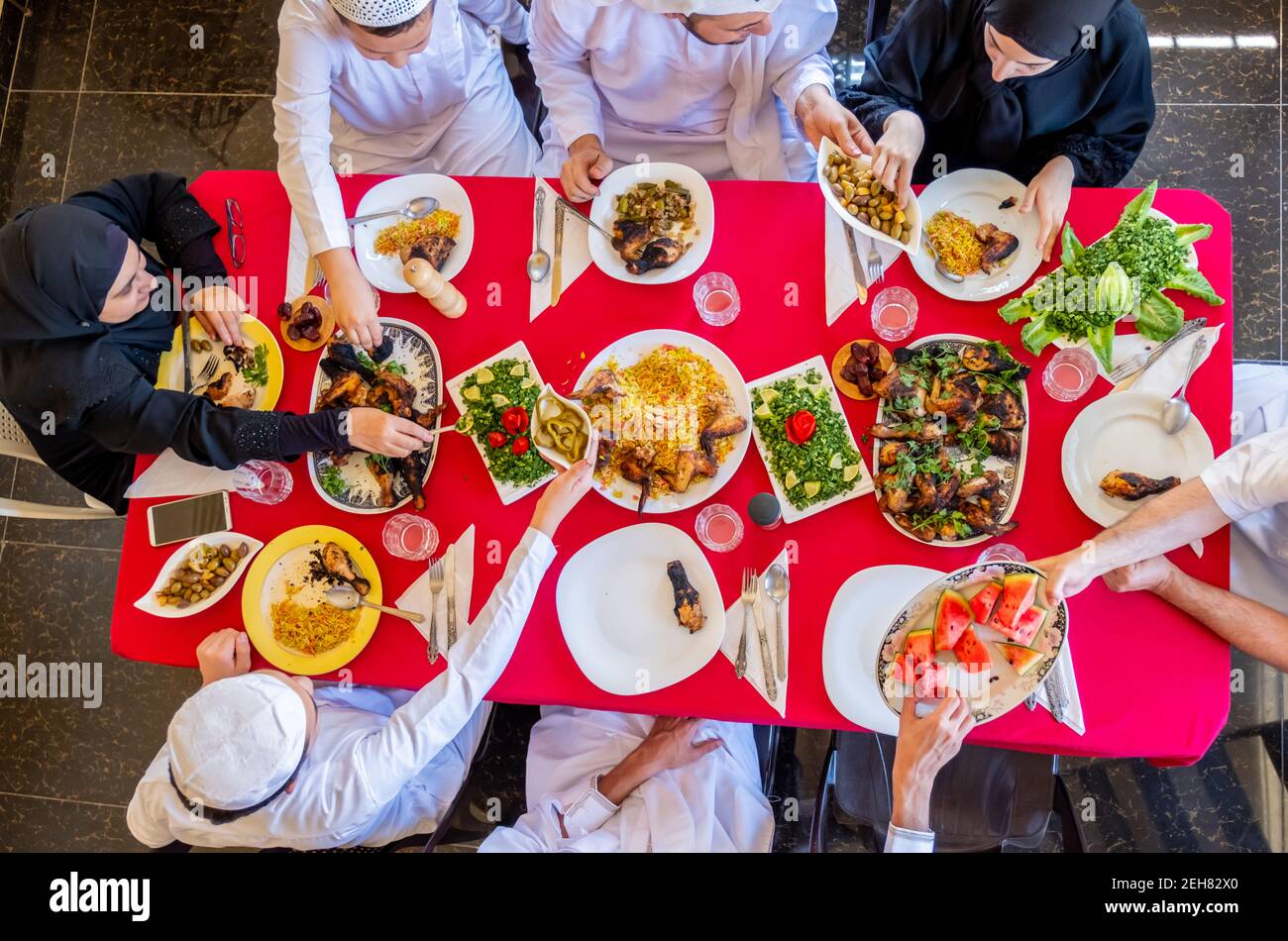 Arabic muslim family eating together Stock Photo - Alamy