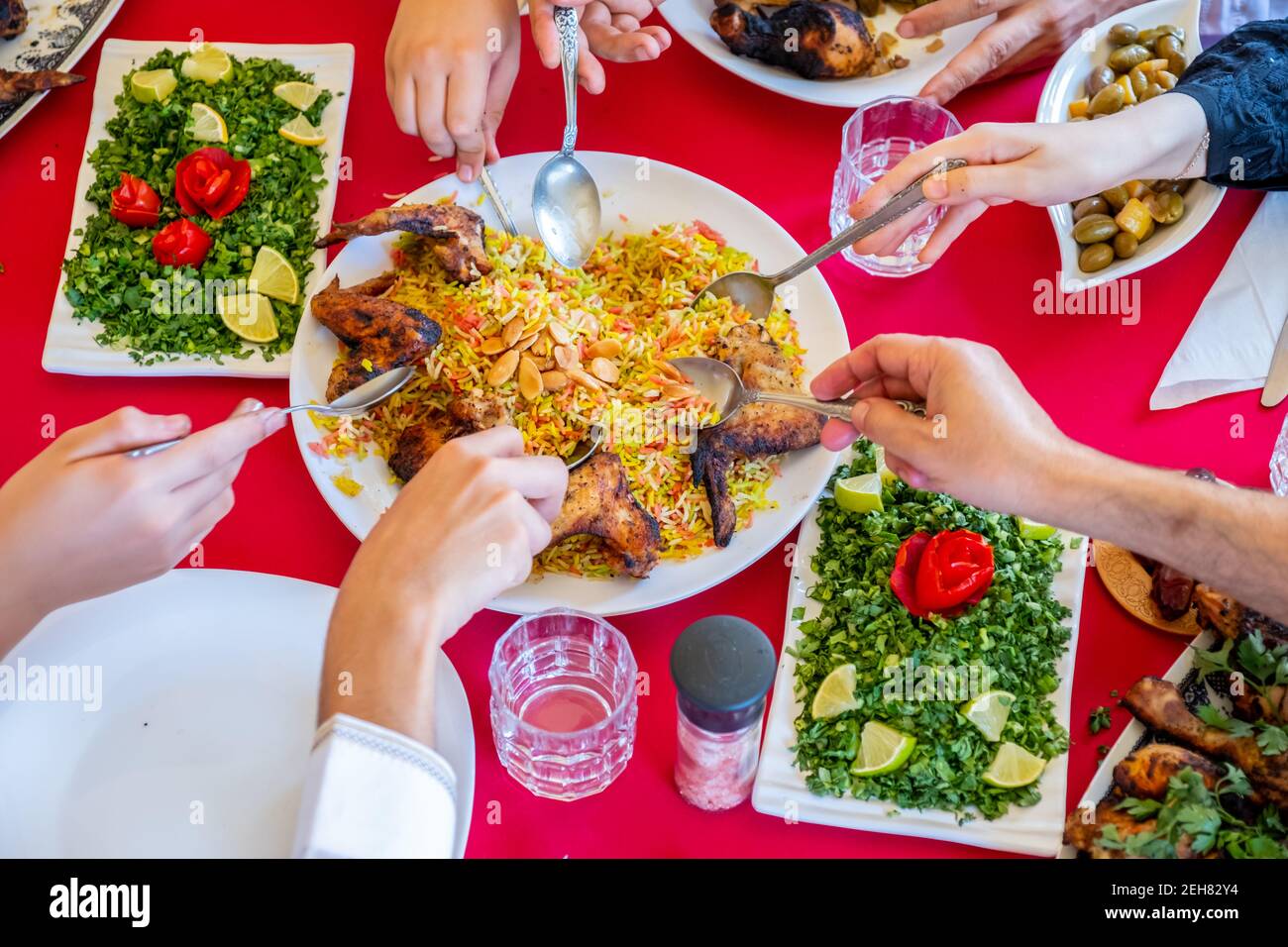 Arabic muslim family eating together Stock Photo - Alamy