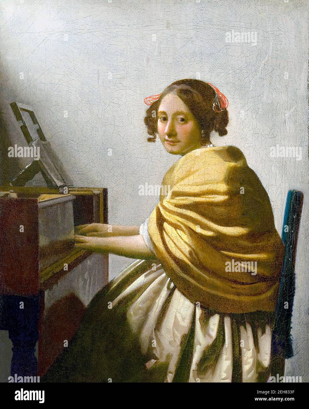 Young woman seated at a virginal hi-res stock photography and images ...