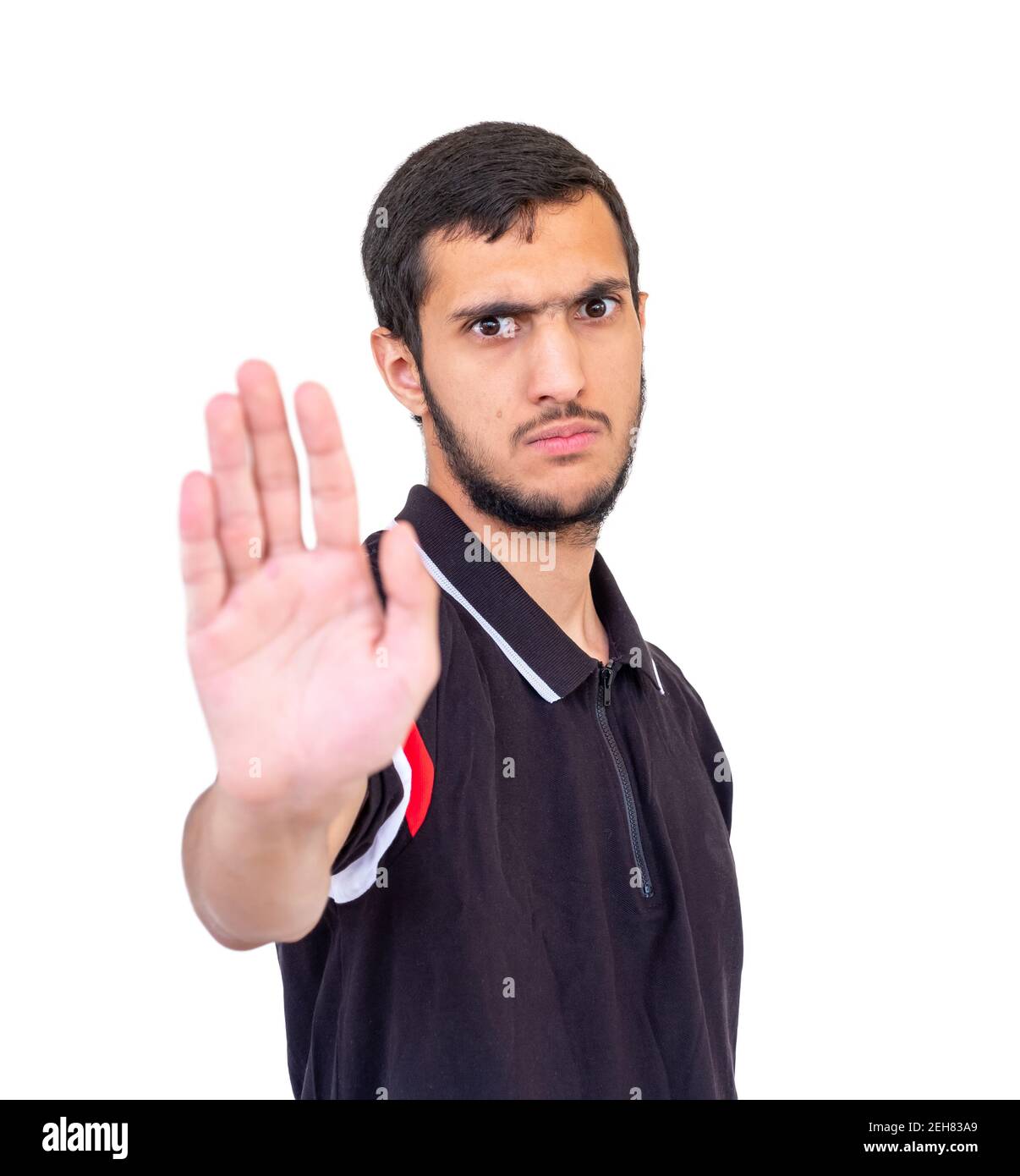 Arabic guy raising his hand as a symbol to stop someone or something ...