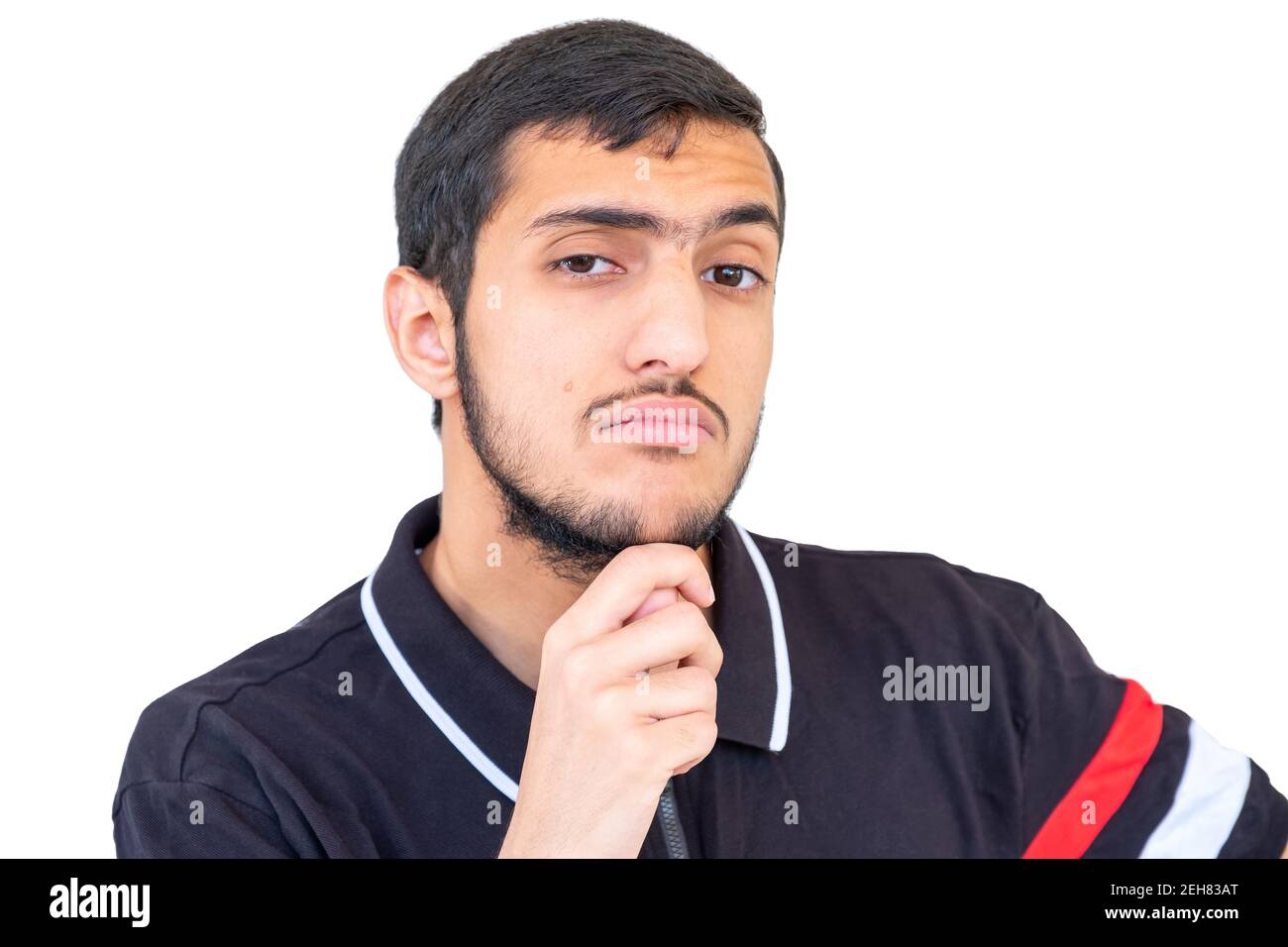 Arabic guy standing and thinking about ideas Stock Photo - Alamy