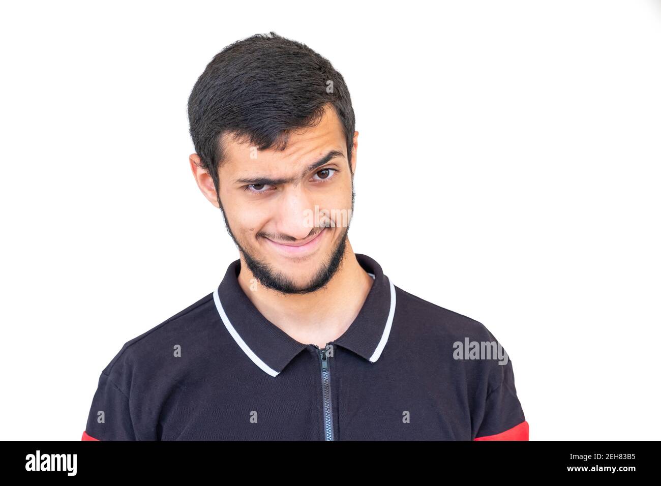 Arabic guy raising one of his eyebrows and smiling with an evil look ... Arabic guy raising one of his eyebrows and smiling with an evil look ...
