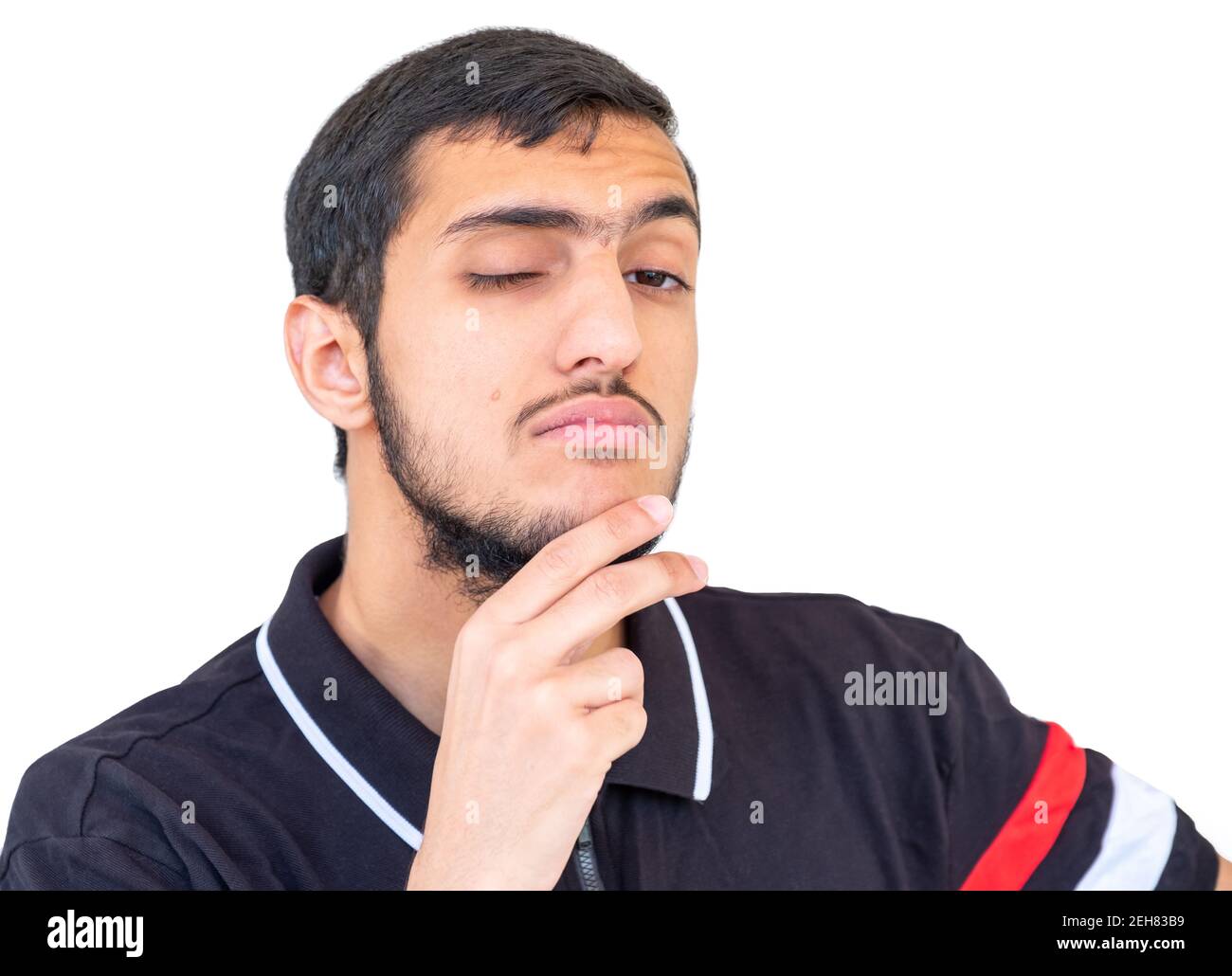Arabic guy standing and thinking about ideas Stock Photo - Alamy