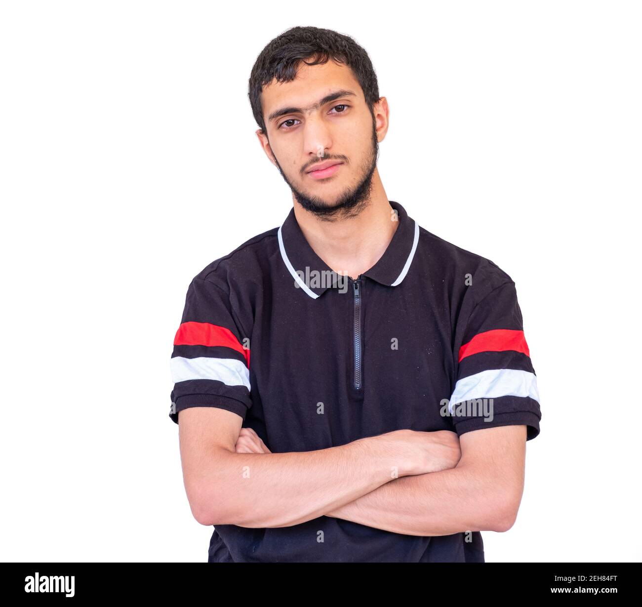 Arabic boy standing with serious look on his face Stock Photo - Alamy
