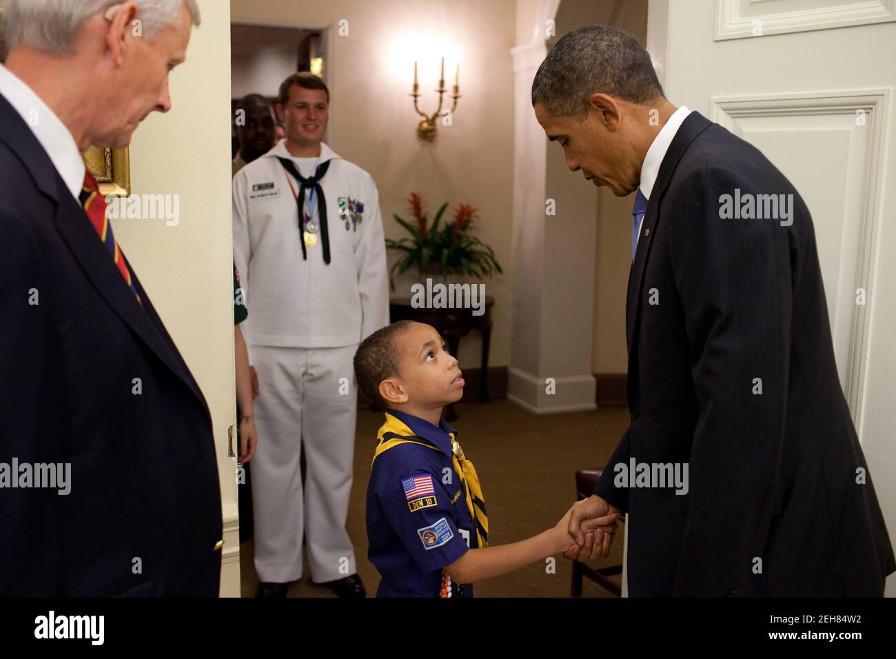 President Barack Obama shakes hands with Cub Scout Raphael Cash from ...